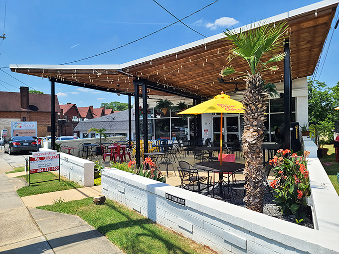 The patio beckons with tropical vibes and that palm tree standing sentinel. This outdoor oasis in Avondale Estates feels like a mini-vacation.