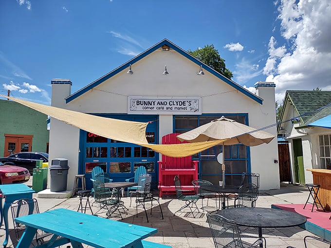 Colorful Adirondack chairs and that statement-making red lifeguard seat create an outdoor space that says, "Stay awhile, the mountains aren't going anywhere."