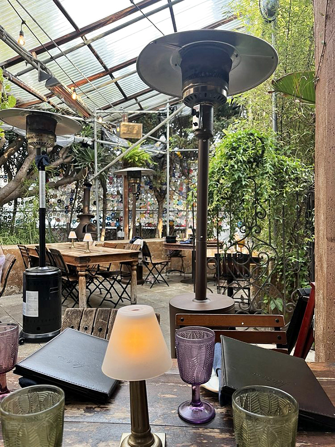 Patio heaters and mismatched glassware signal a place where comfort matters more than matching everything perfectly&mdash;as it should.