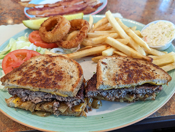 A patty melt that achieves that perfect trifecta: crispy bread, melty cheese, and a burger patty that makes you temporarily forget all other food groups.