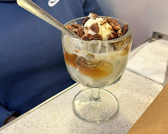 A sundae that understands the importance of proper pecan-to-caramel ratio. This glass contains more joy than most people experience in a week.