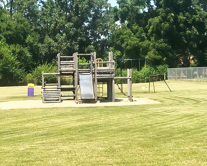 Simple playground equipment offers neighborhood children outdoor adventures without elaborate theme parks or admission fees.
