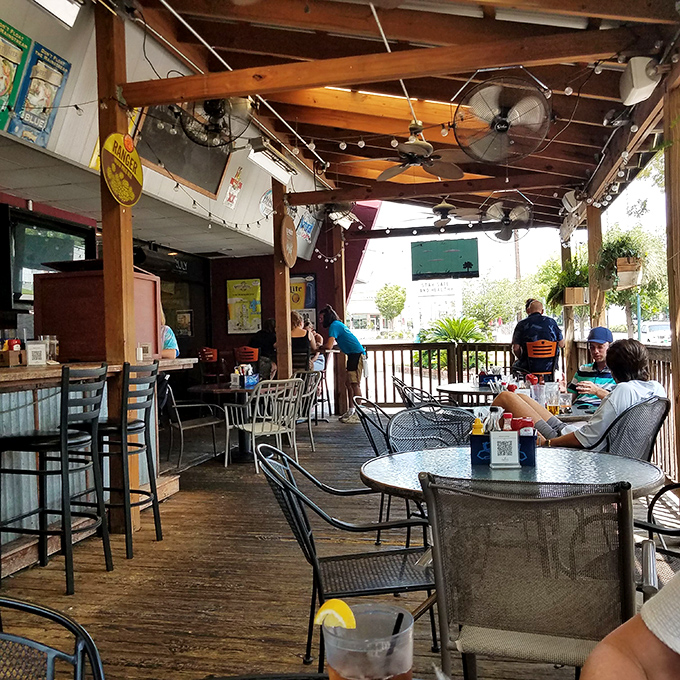 The covered porch offers prime people-watching with a side of South Carolina breeze&mdash;nature's air conditioning for burger enthusiasts.