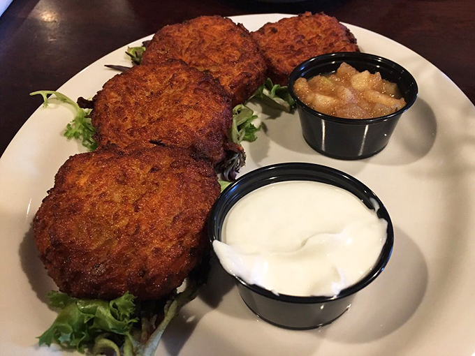 Potato pancakes with the perfect crisp-to-tender ratio, flanked by cool sour cream and sweet applesauce &ndash; the holy trinity of comfort food done right.