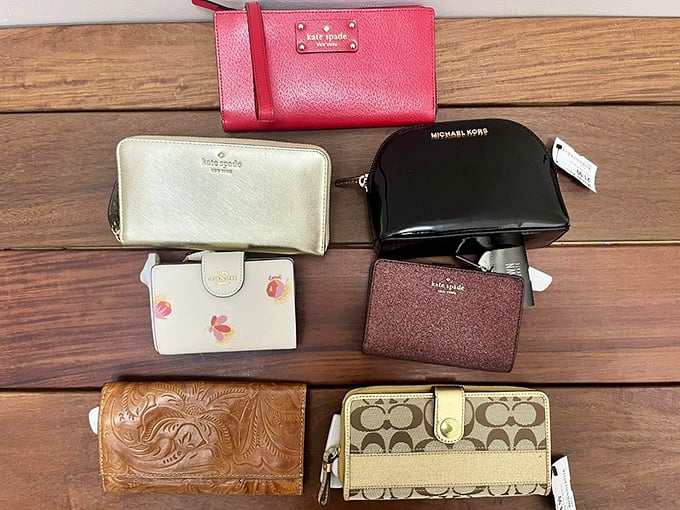 Designer wallet wonderland where luxury meets practicality. Kate Spade, Michael Kors, and Coach gathered for a high-end huddle at low-end prices.