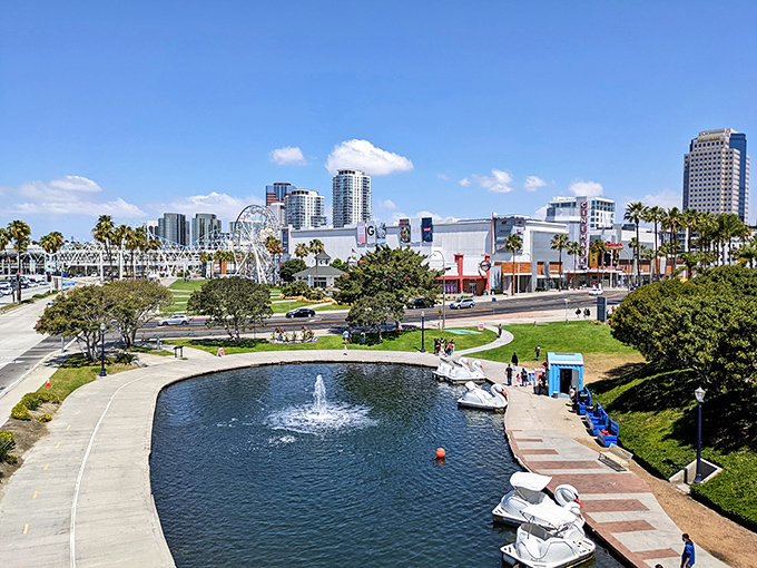 Rainbow Lagoon Park creates an oasis of blue amid the urban landscape, where paddle boats wait for visitors to take a spin around the fountain.