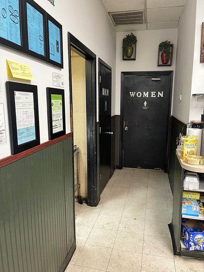 Even the hallway to the restrooms tells a story of a well-maintained establishment where every detail matters in creating the complete diner experience.