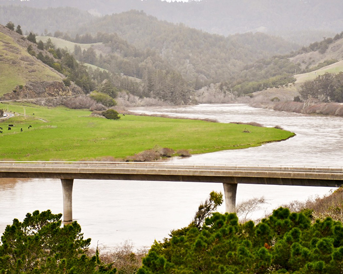 River valleys carve gentle pathways to the sea, a serene counterpoint to the drama of the coastal cliffs.