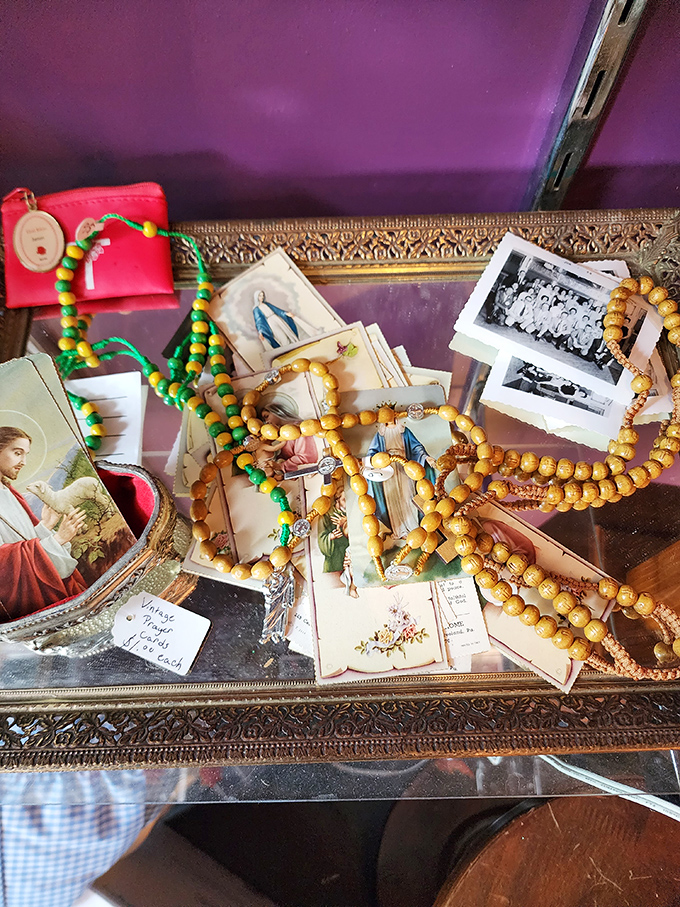 Religious artifacts mingle with vintage photographs, creating an unexpected juxtaposition of the sacred and the historical.