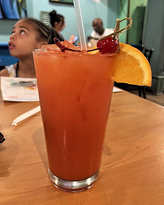 This rum punch isn't just a drink—it's a vacation in a glass, complete with enough fruit to count as breakfast if you're feeling particularly creative.