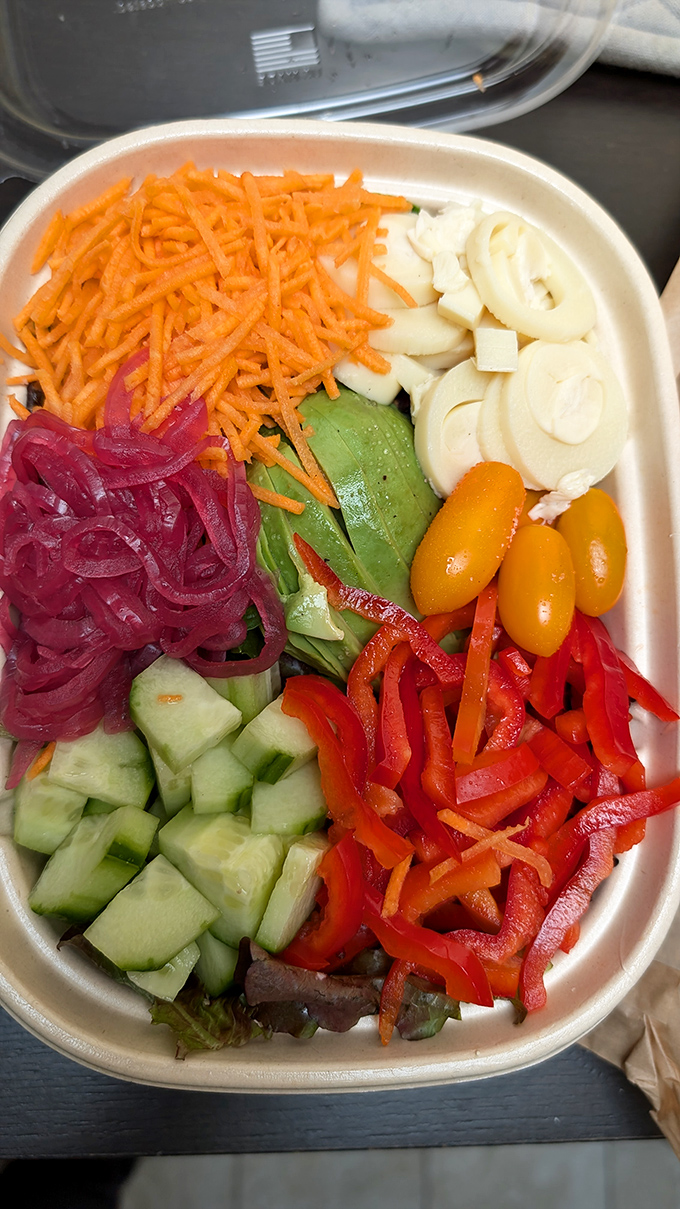 This vibrant salad bowl proves Deli Board isn't just about meat between bread&mdash;it's a colorful testament to California's produce prowess and balanced eating.
