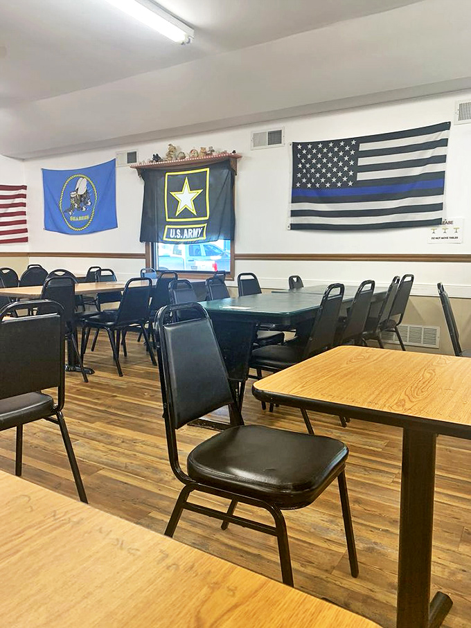 Military flags adorn the walls, reflecting the restaurant's appreciation for service members and adding to the unpretentious, hometown atmosphere.
