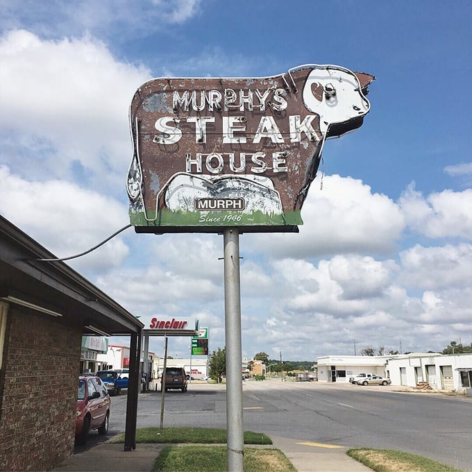 That weathered cow sign doesn't just advertise a restaurant&mdash;it announces an institution where Oklahoma's comfort food traditions are preserved one chicken fried steak at a time.