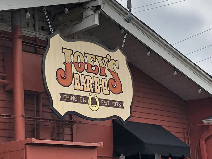 The hanging sign announces your arrival at meat paradise. That horseshoe isn't just decoration &ndash; it's catching all the good barbecue luck.