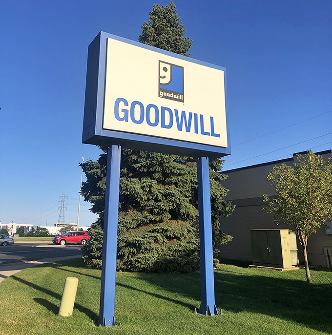 Another angle of thrifting paradise, where that perfect sign reminds you exactly where the magic happens.