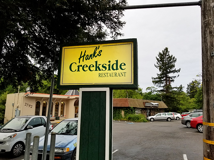 The cheerful yellow sign stands as a beacon of breakfast hope. Like a lighthouse guiding hungry sailors to the shores of satisfaction.