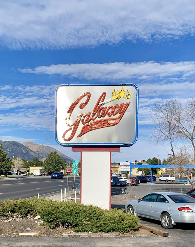 The roadside sign stands tall against Flagstaff's mountain backdrop &ndash; a shining reminder that good diners, like good friends, are always worth the drive.