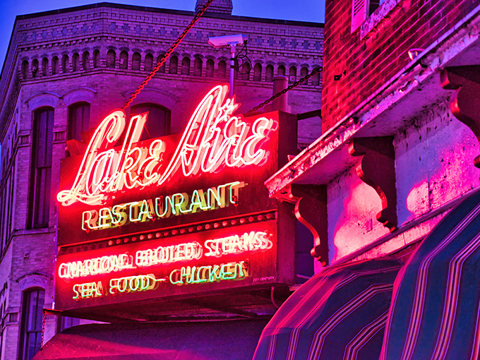 The neon sign glows like a nighttime beacon, promising tomorrow's breakfast even as today's dinner service winds down.