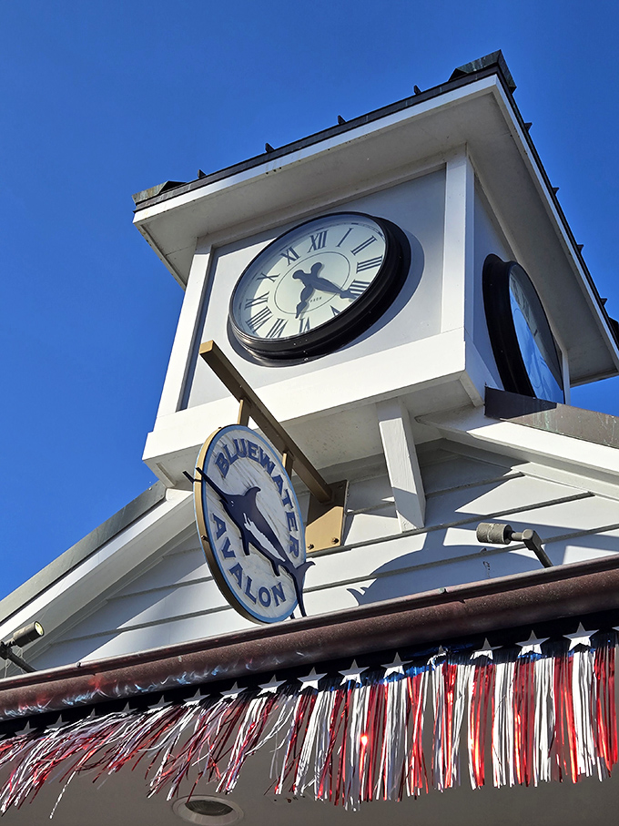 The Bluewater Avalon sign and clock tower stand as beacons for hungry travelers, like a lighthouse guiding ships to delicious shores.