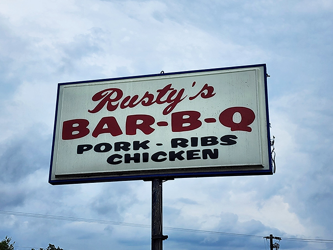 That roadside sign doesn't mince words &ndash; it tells you exactly what treasures await: pork, ribs, and chicken, all transformed by smoke and time.