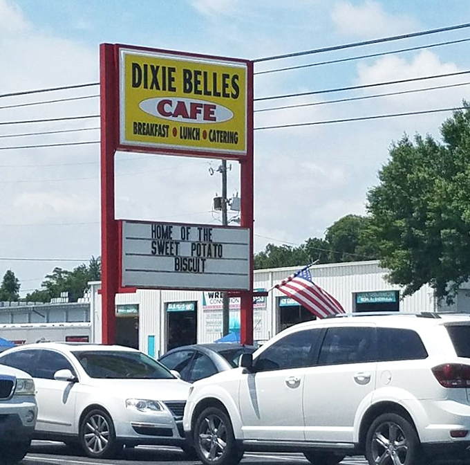 The roadside sign proudly proclaims Dixie Belle's as the "Home of the Sweet Potato Biscuit," a claim that draws hungry drivers from miles around.
