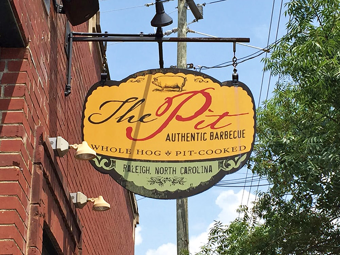 That sign has guided hungry souls to barbecue salvation since this Raleigh treasure opened its doors.