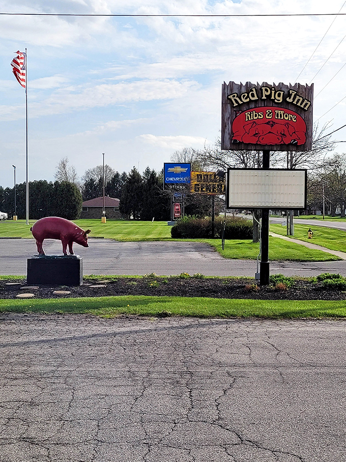 The outdoor pig statue stands guard, a proud sentinel welcoming hungry travelers to their smoky salvation destination.
