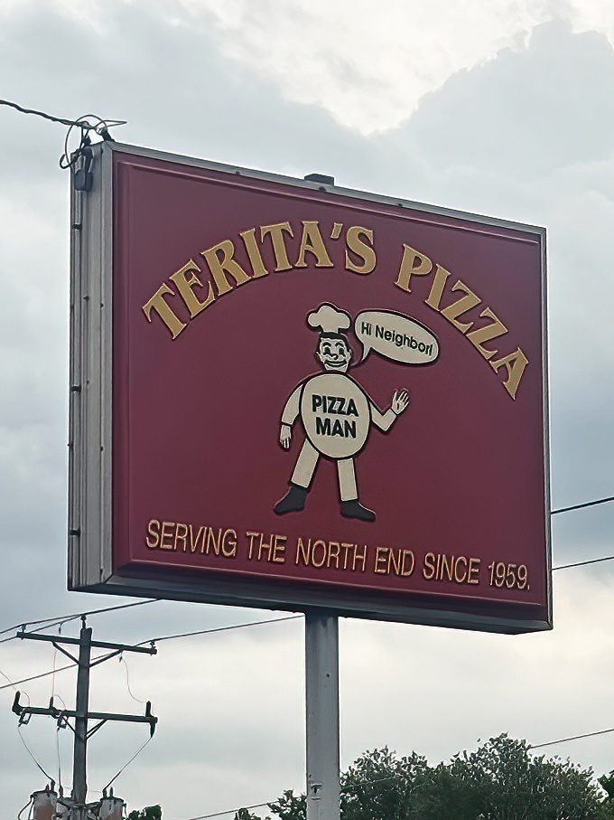The iconic Terita's sign features their cheerful "Pizza Man" mascot, whose "Hi Neighbor!" greeting has welcomed Columbus residents since the Eisenhower administration.