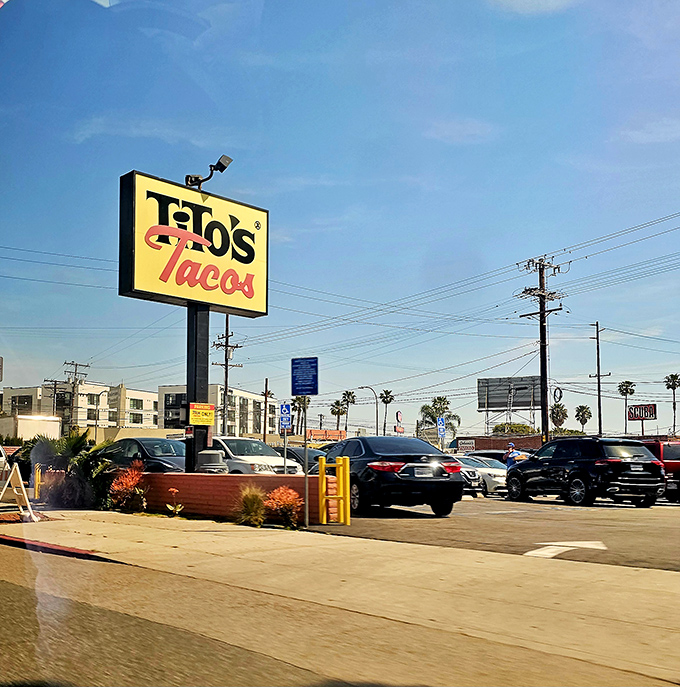 That yellow sign against the blue California sky—a beacon of hope for the hungry, visible from blocks away.