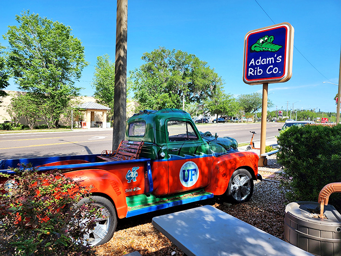 The Gator-themed truck stands guard outside, a colorful sentinel promising smoky delights within. UF pride never tasted so good.