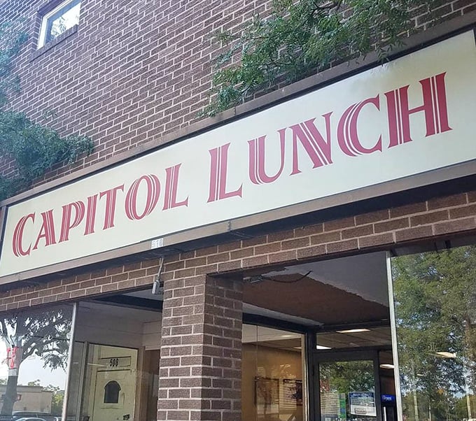 The Capitol Lunch sign stands as a beacon of hope in a world of complicated dining. Simple pleasures, proudly served since before Instagram could ruin them.