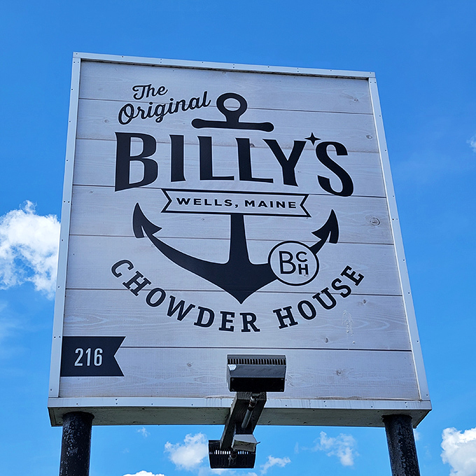 The iconic sign stands tall against Maine's perfect blue sky &ndash; a beacon for seafood lovers who know where true flavor lives.