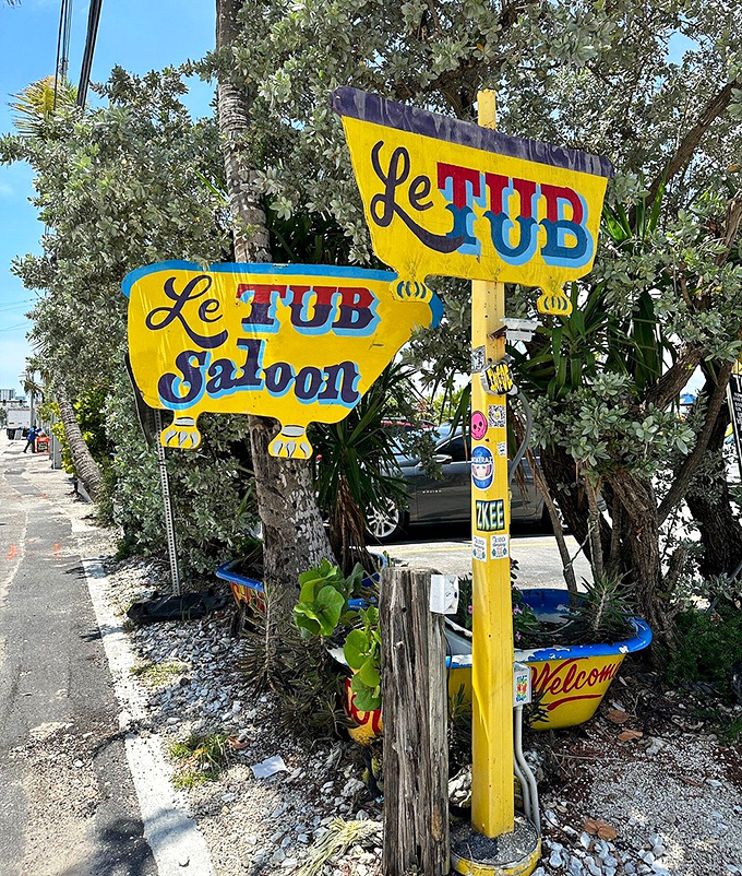 The quirky yellow signage announces "Le Tub Saloon" with the same understated confidence as the burgers it represents.