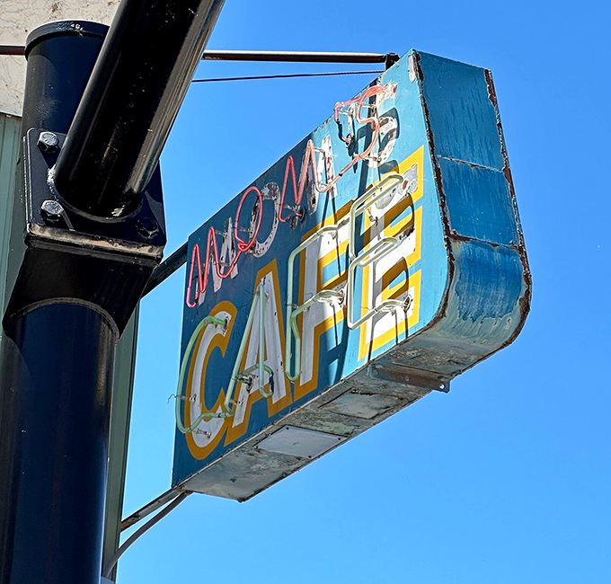 Not all neon signs are created equal – this weathered blue beacon has guided hungry travelers to comfort food salvation for generations of cross-country adventurers.