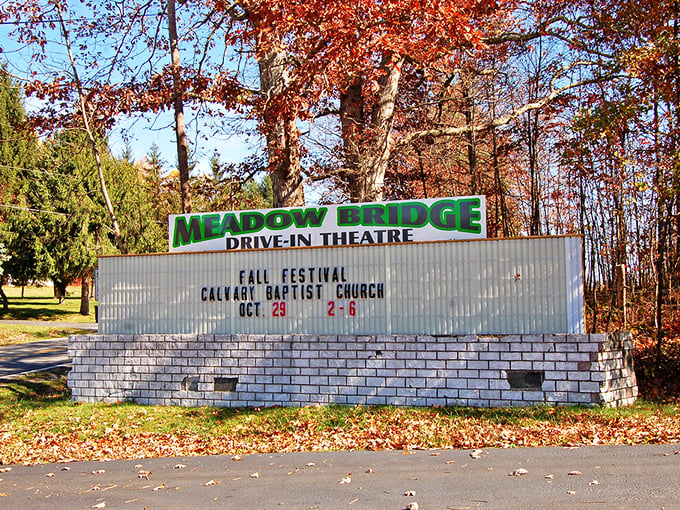 The marquee announces more than movies—it's a community bulletin board. Fall festivals and film titles share equal billing in this small-town treasure.