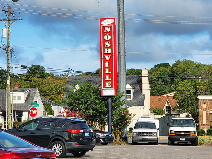 That vertical sign stands tall like a delicatessen lighthouse, guiding hungry travelers to the promised land of pastrami.