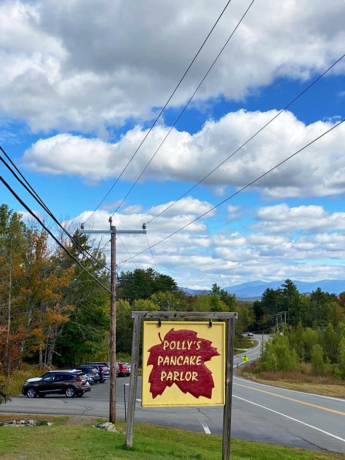 The roadside sign stands proud against mountain views &ndash; like a lighthouse guiding hungry travelers to breakfast salvation.