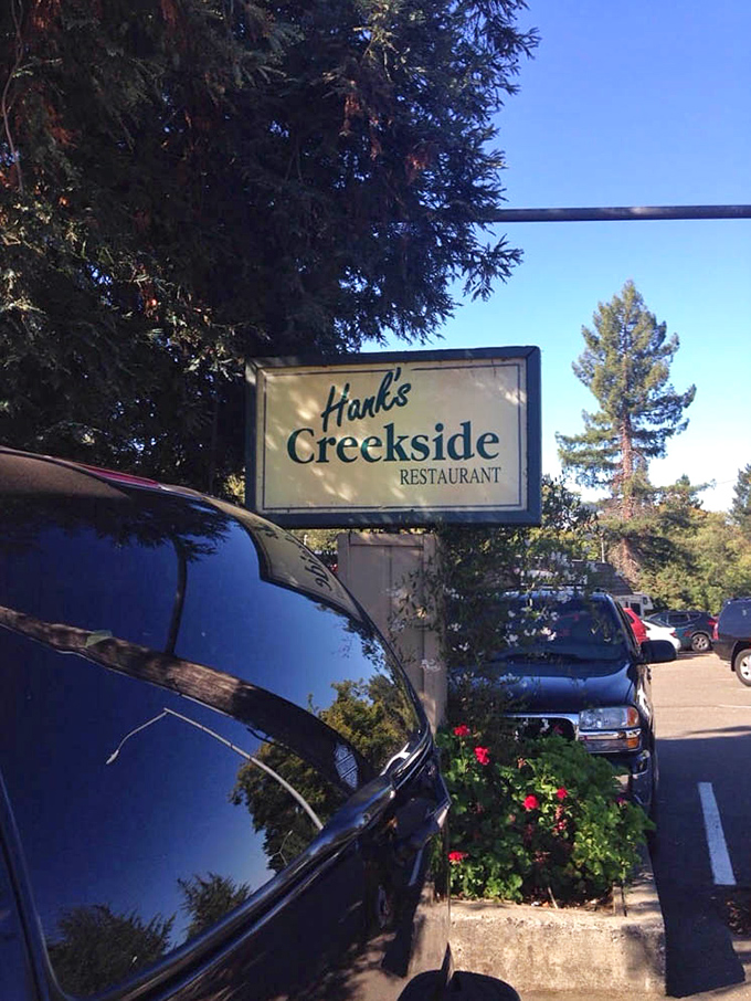 The sign stands as a beacon to hungry travelers, like a lighthouse guiding ships to the safe harbor of good food.