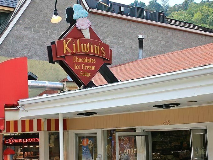 The iconic Kilwins sign stands proud against Tennessee skies, a beacon of sweetness that's guided sugar-seekers for generations.