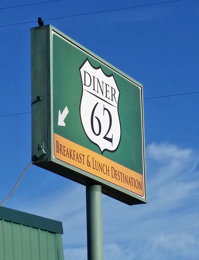 The highway-inspired sign stands tall against Oregon's blue sky, a roadside promise that good things come to those who exit.