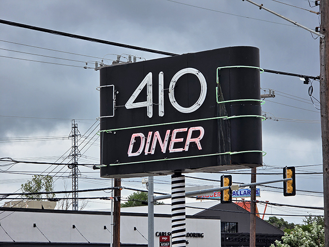 That neon sign isn't just advertising&mdash;it's a beacon of hope for hungry travelers and a landmark for locals giving directions. 