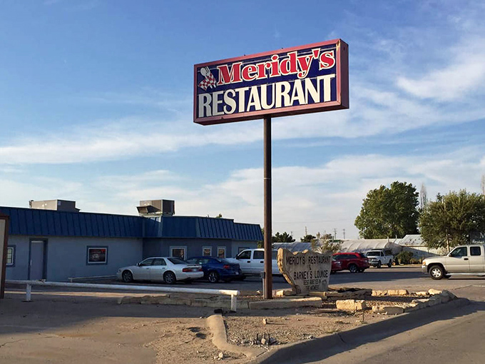 The iconic Meridy's sign stands tall against the Kansas sky, a landmark that's guided hungry travelers for generations.
