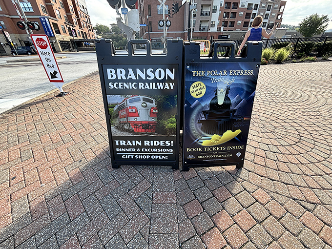 Sidewalk signage announces two magical journeys: scenic daytime adventures and nighttime trips to the North Pole. Choose your adventure!