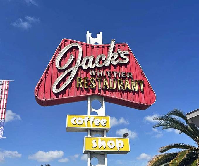 By day, a classic red sign. By night, a neon beacon promising comfort food salvation. Some landmarks don't need to be in guidebooks.