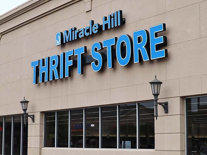 The distinctive blue lettering pops against the neutral building, making it impossible to miss this thrifting destination on Pleasantburg Drive.