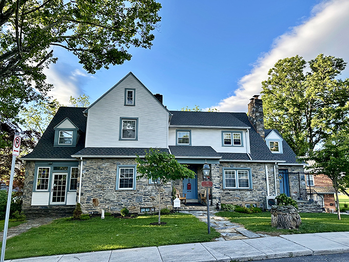 Stone and clapboard create a textural symphony in this historic home. The pathway practically whispers "follow me" to architectural admirers.