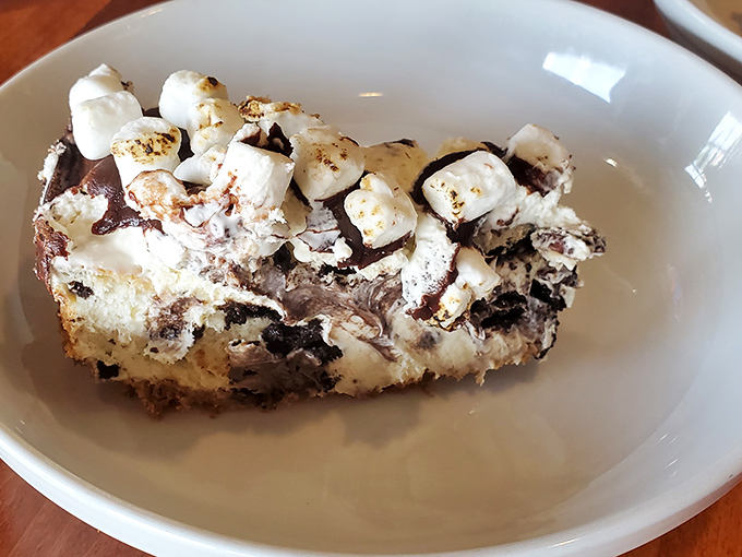 S'mores cheesecake: where campfire nostalgia meets grown-up indulgence in a dessert that makes you want to high-five the chef.
