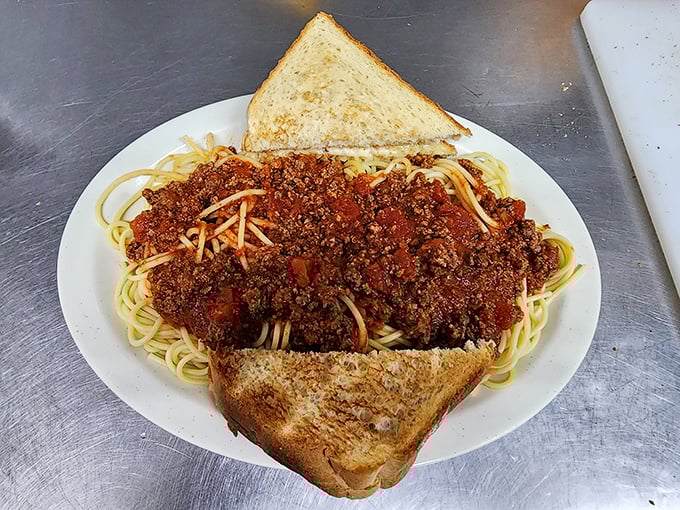 Spaghetti with meat sauce that doesn't pretend to be Italian&mdash;it's pure Wisconsin comfort, sandwiched between perfectly buttered toast.