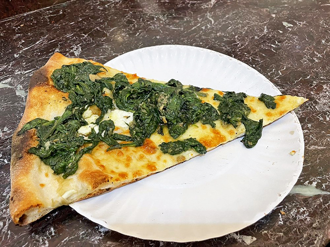 The spinach slice—where healthy meets hedonistic. Proof that vegetables can be just as indulgent as their meaty counterparts.