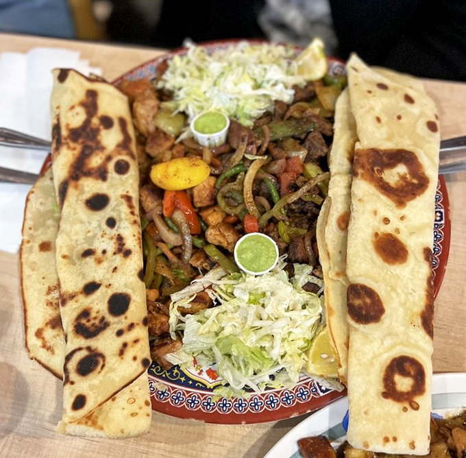 A feast fit for royalty, served on a humble plate. The chapati stands guard like sentinels protecting the flavorful treasure within.
